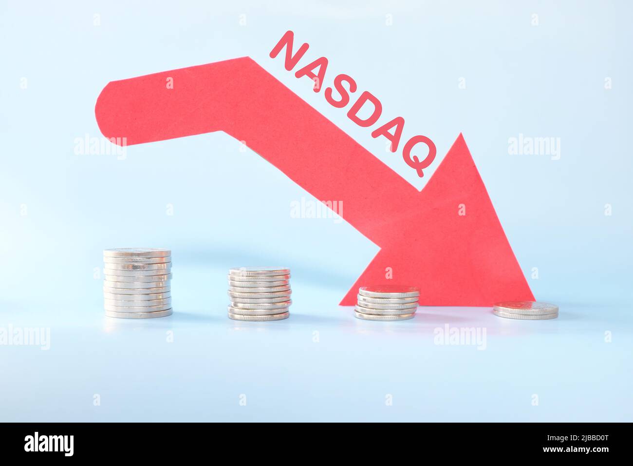 NASDAQ index in red downward arrow with decreasing stack of coins ...
