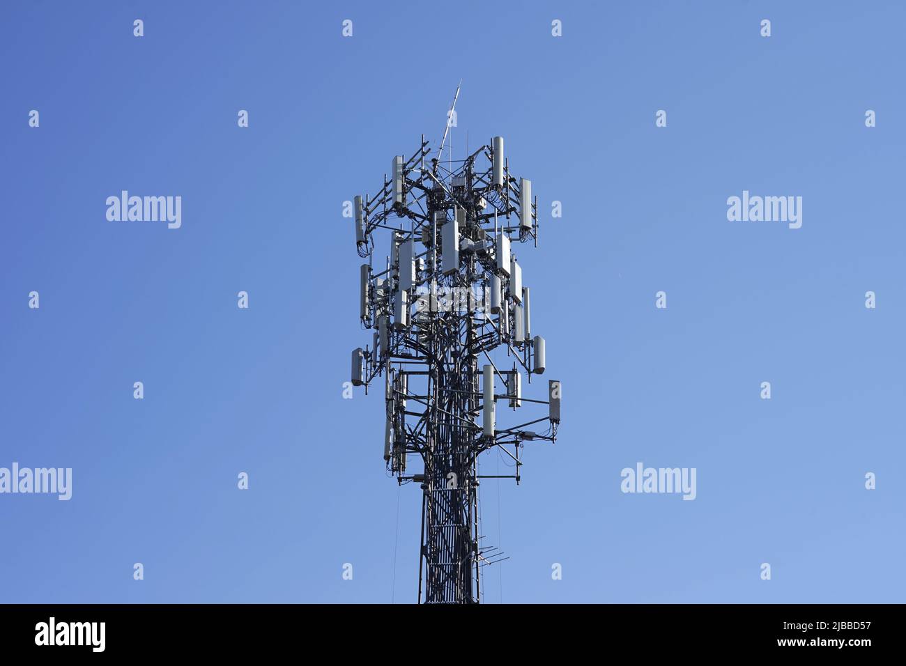 A cell phone tower with multiple antennas Stock Photo - Alamy