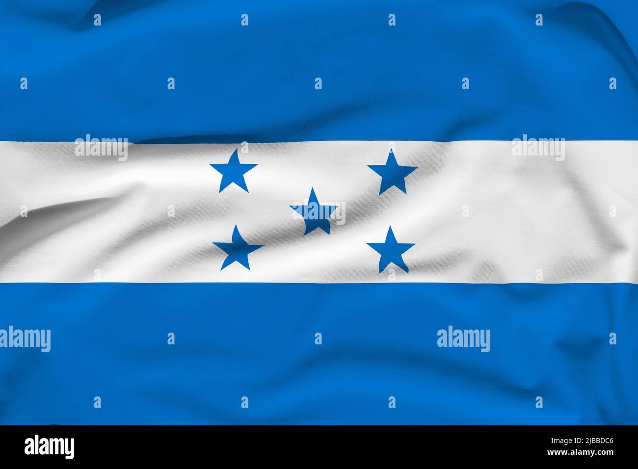Honduras national flag, folds and hard shadows on the canvas Stock ...