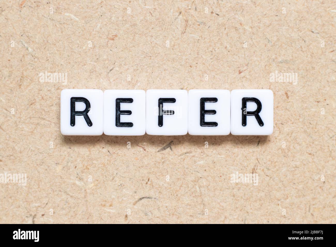 White tile alphabet letter with word refer on wood background Stock ...