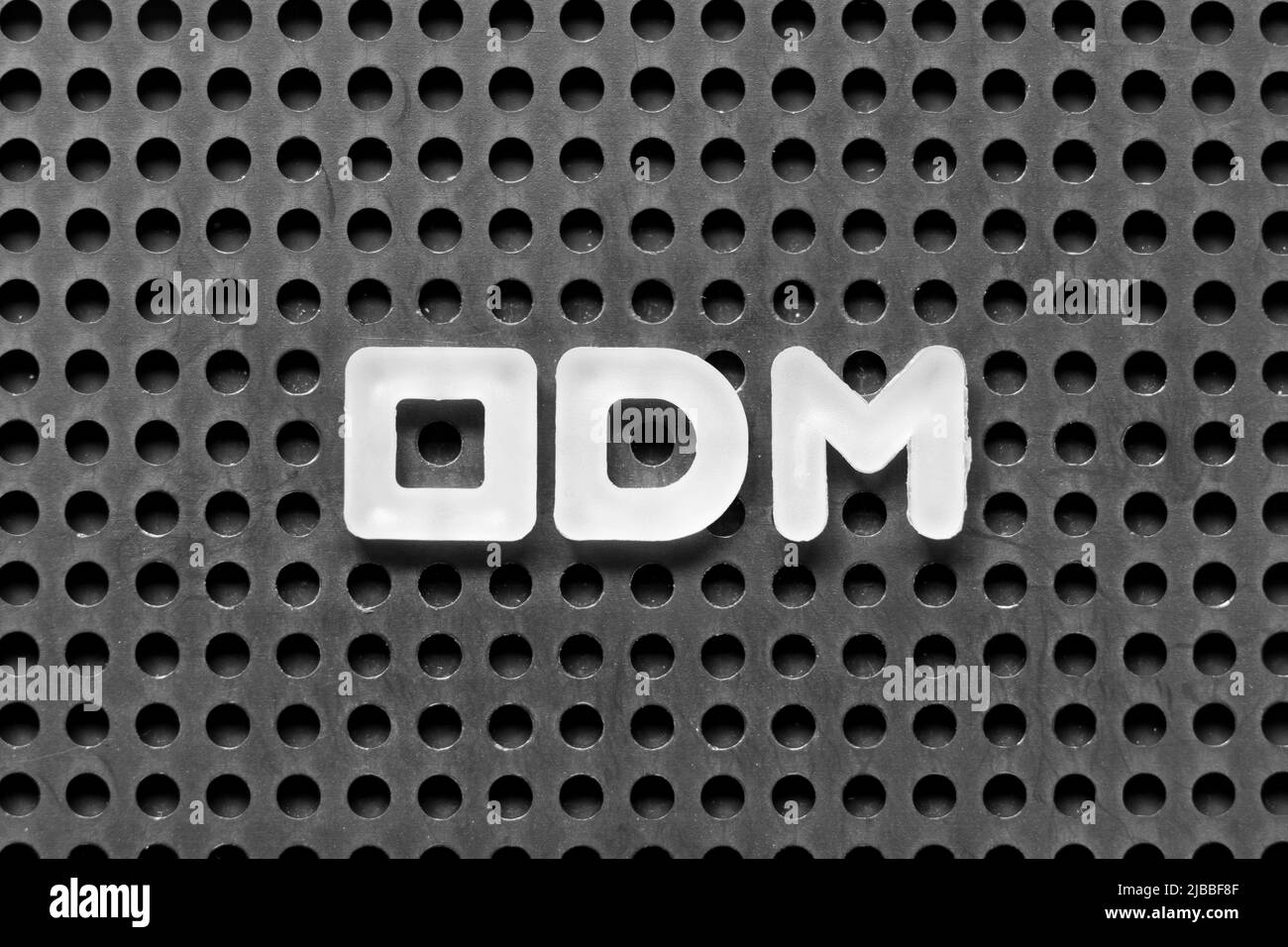 White alphabet letter in word ODM (Abbreviation of Original design ...