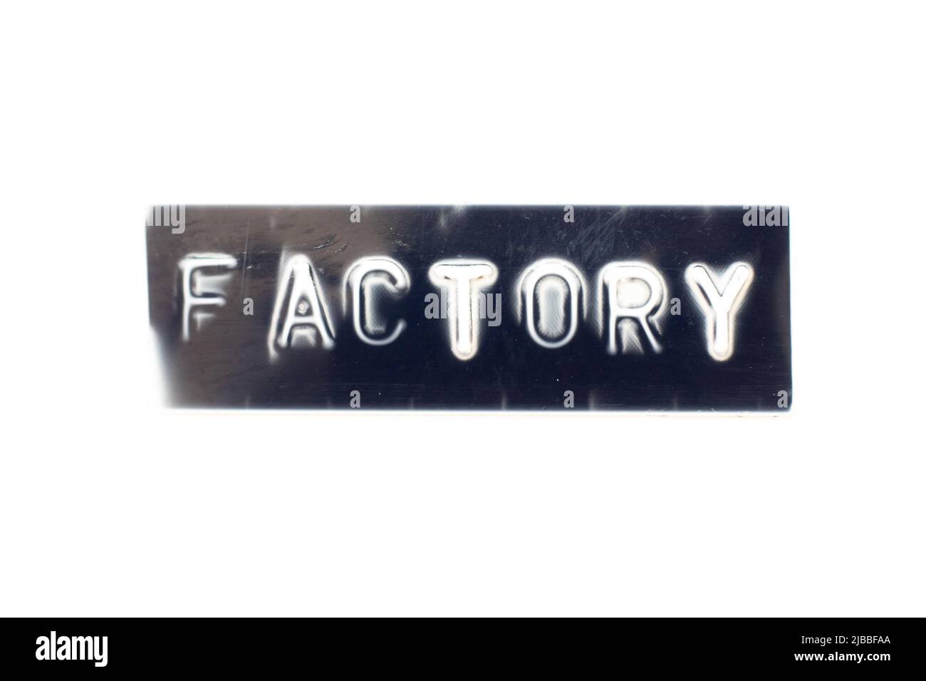 Embossed letter in word factory on black banner with white background ...