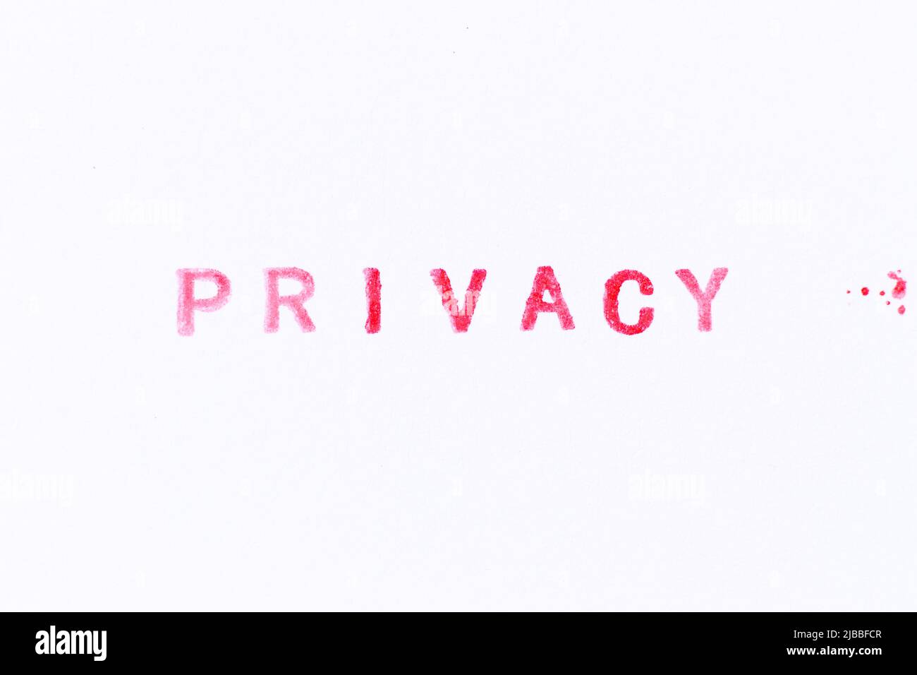 Red color ink rubber stamp in word privacy on white paper background ...