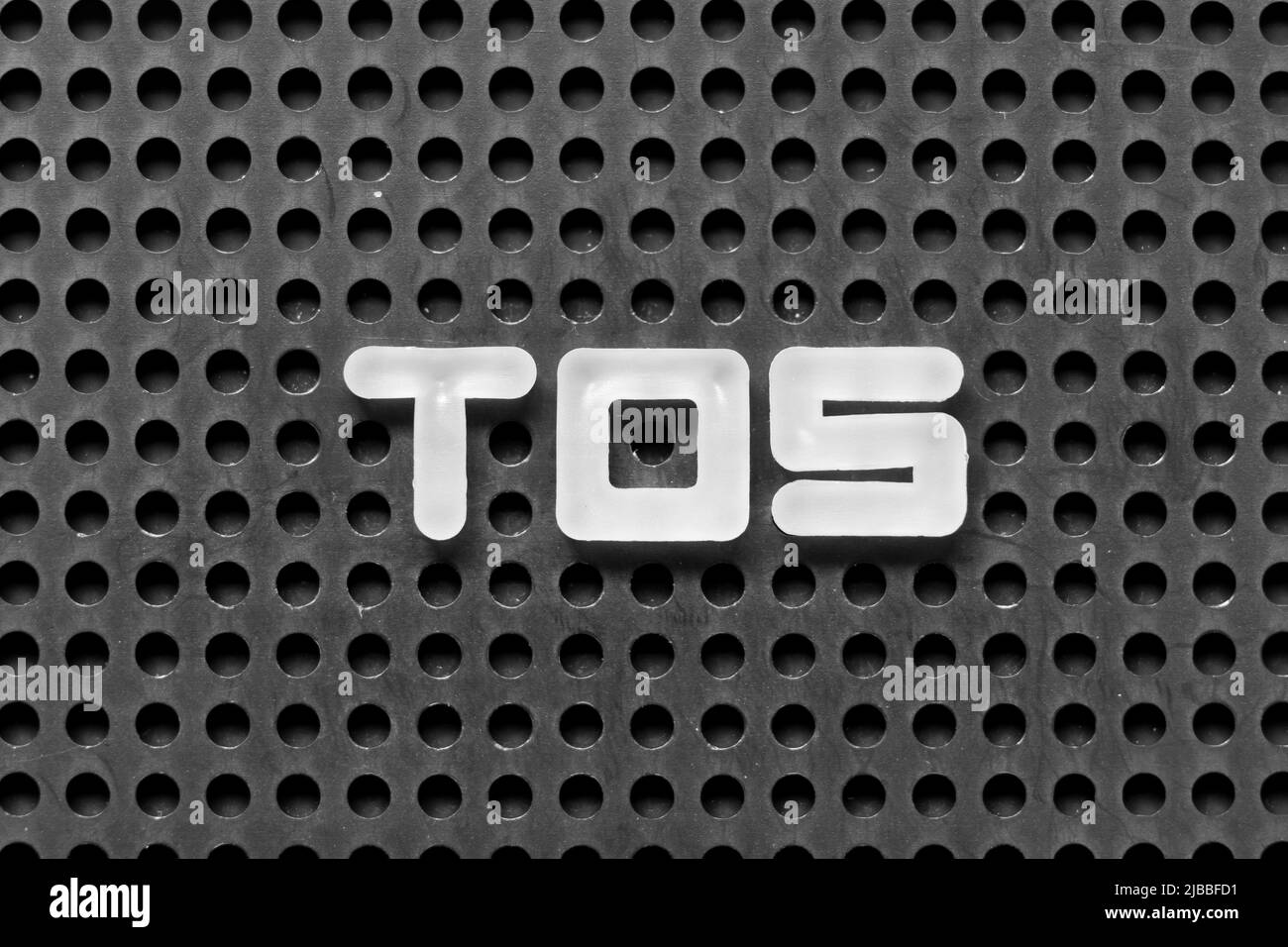 White alphabet letter in word TOS (abbreviation of Terms of service) on ...