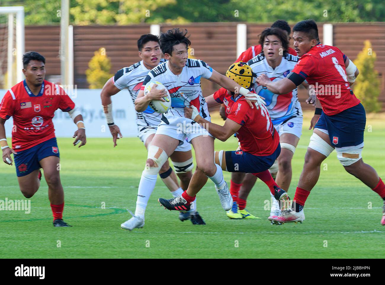 South Korea's Kim Hyun-soo is tackled during the Asia Rugby ...