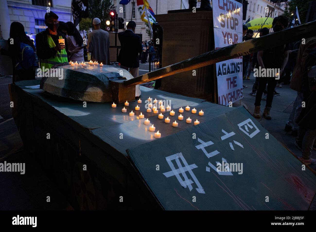 Electric candles are seen lit on the tank arts installation made from ...
