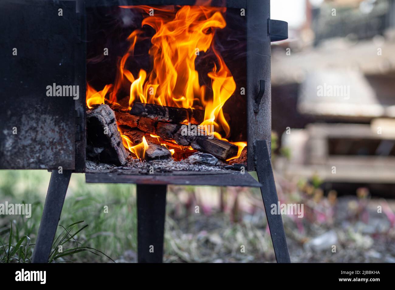Cooking food or pilaf in a cauldron on fire. Cooking in cauldron on ...