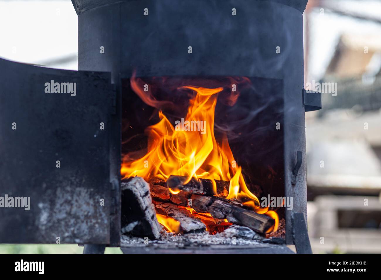 Cooking food or pilaf in a cauldron on fire. Cooking in cauldron on ...