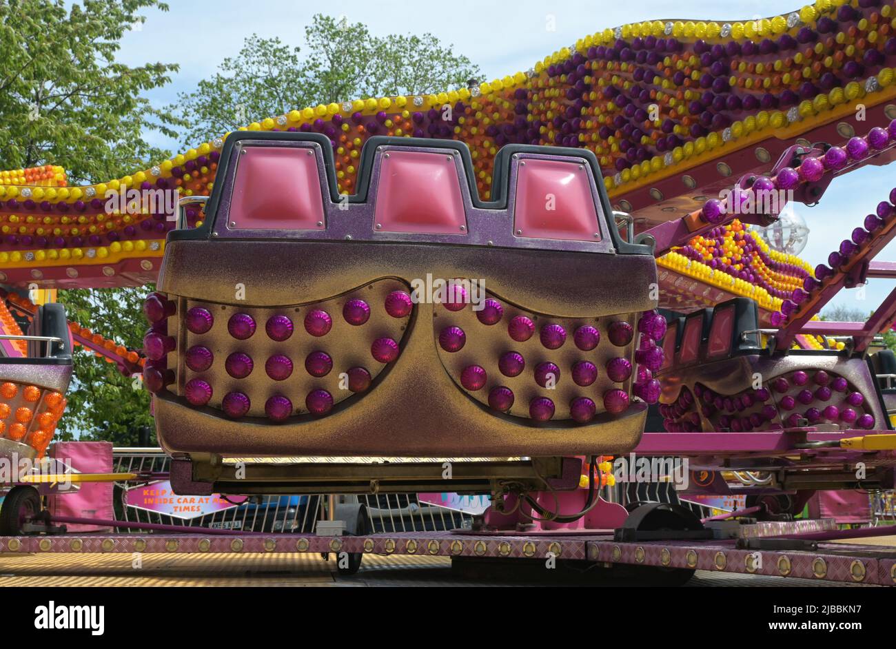 twister ride with purple lights Stock Photo - Alamy