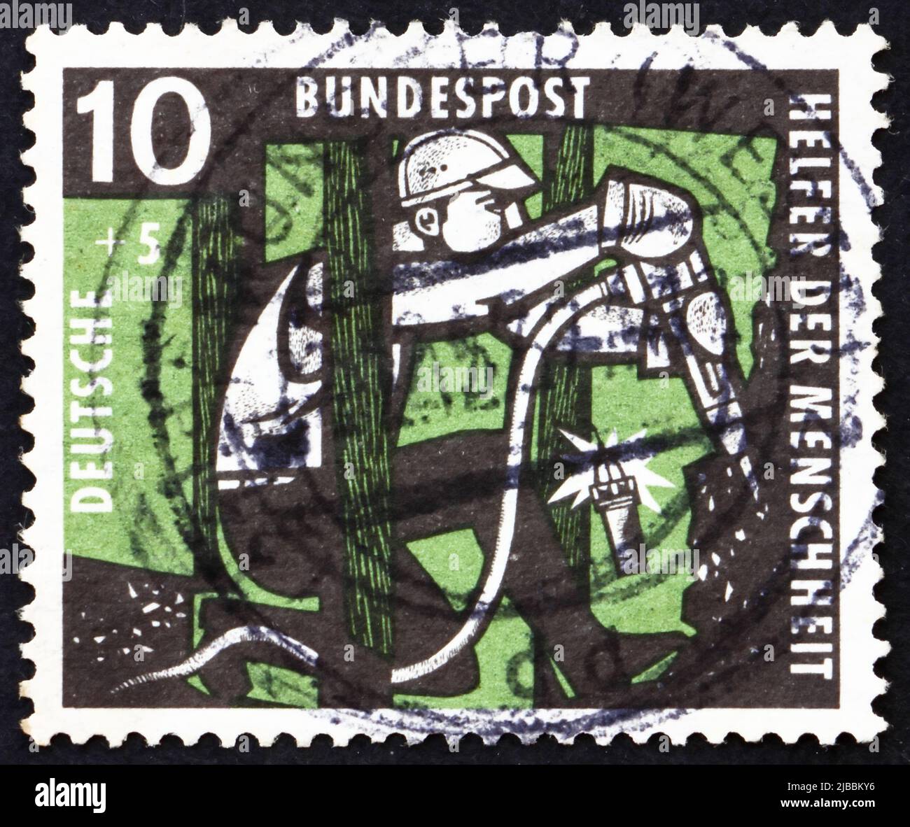 GERMANY - CIRCA 1957: a stamp printed in the Germany shows Miner with ...