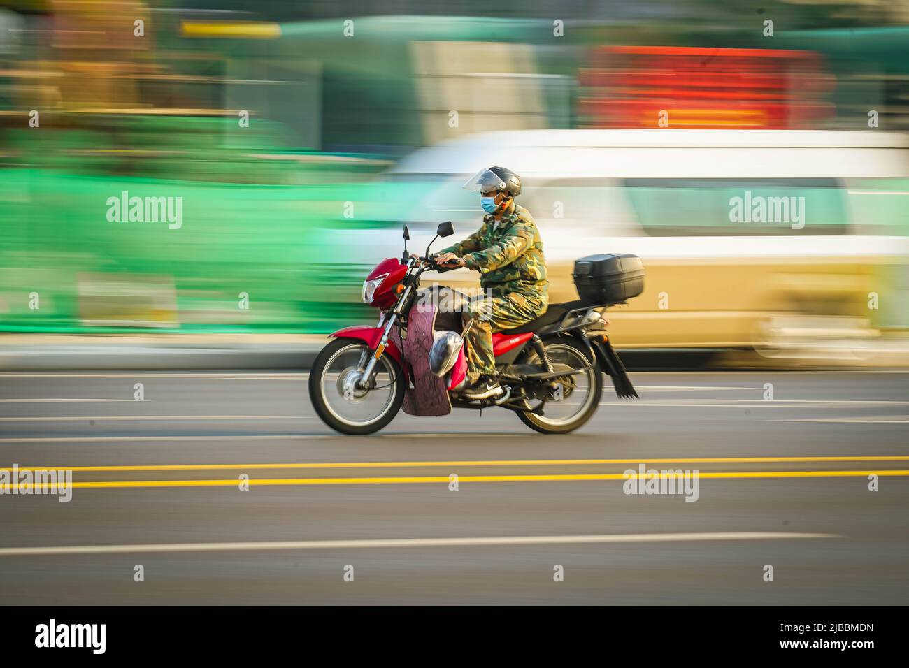 Panning shot of moving motorcycle, motion picture Stock Photo - Alamy