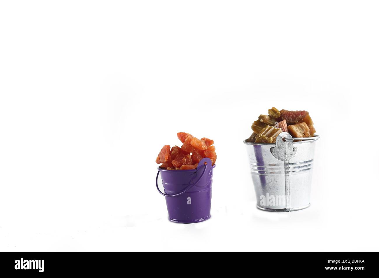 Healthy eating concept - buckets of candied rheum and pumpkins isolated ...