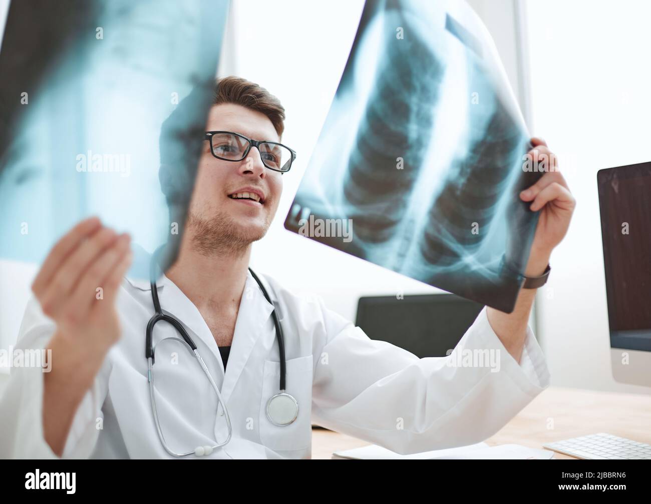 Female doctor examines male patient hi-res stock photography and images ...