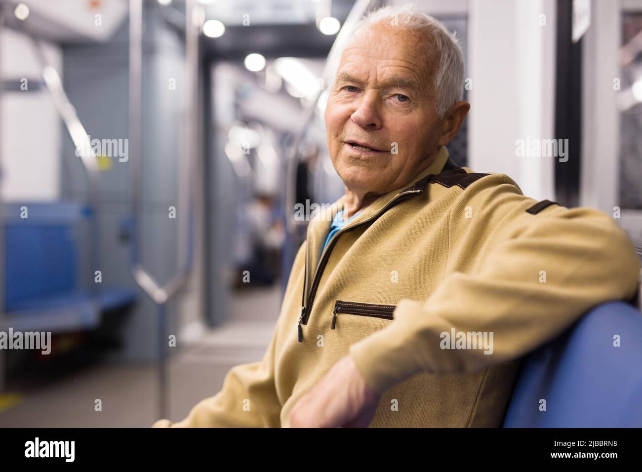 Portrait Of Elderly European Man 75 Years Old Sitting In Underground
