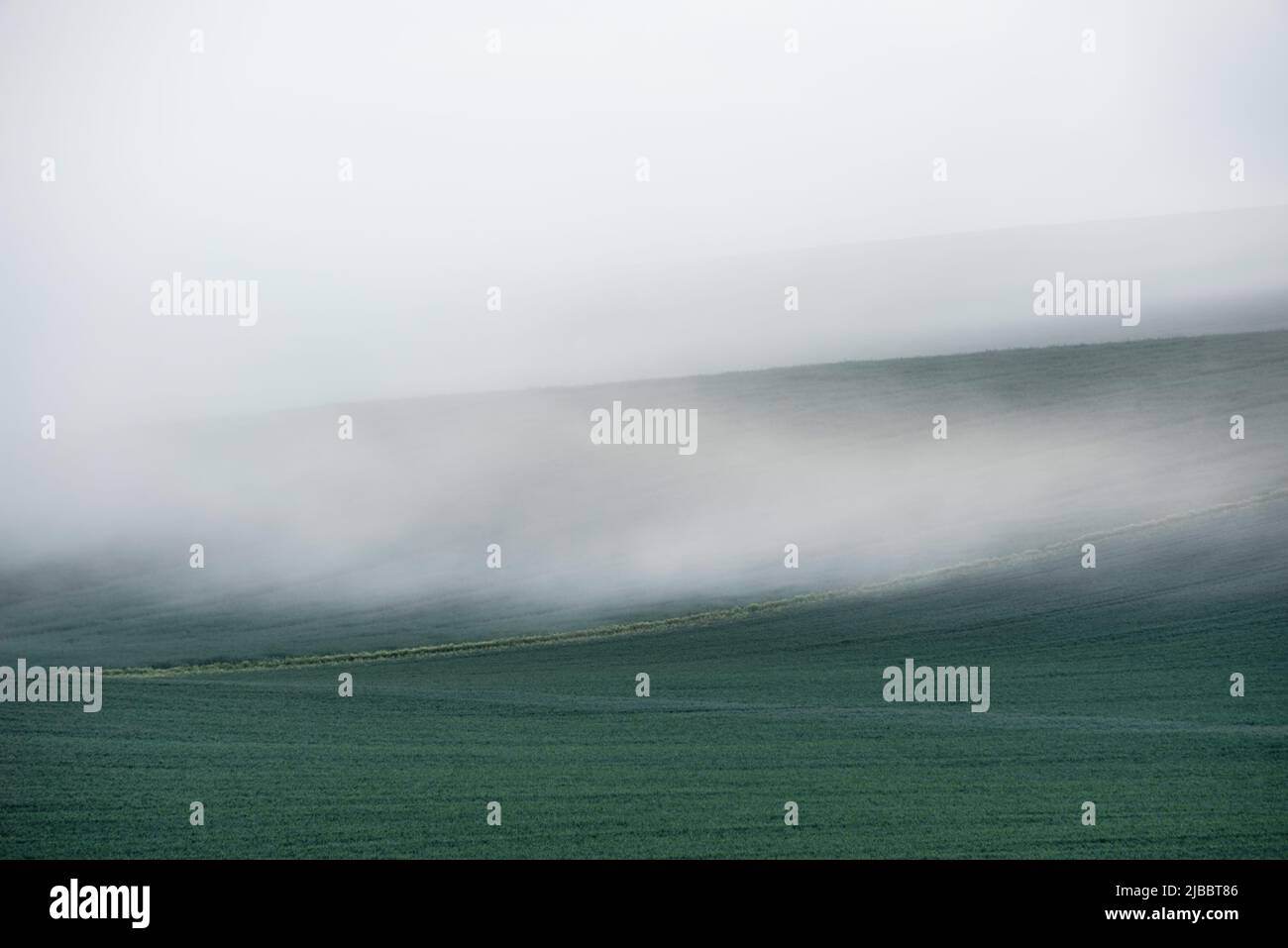 Beautiful landscape image of sea of fog rolling across South Downs ...