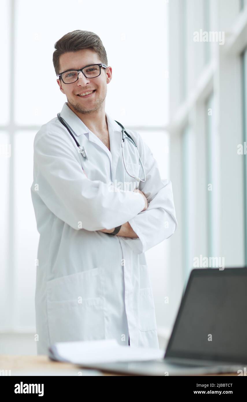 handsome young doctor portrait in medical office Stock Photo - Alamy