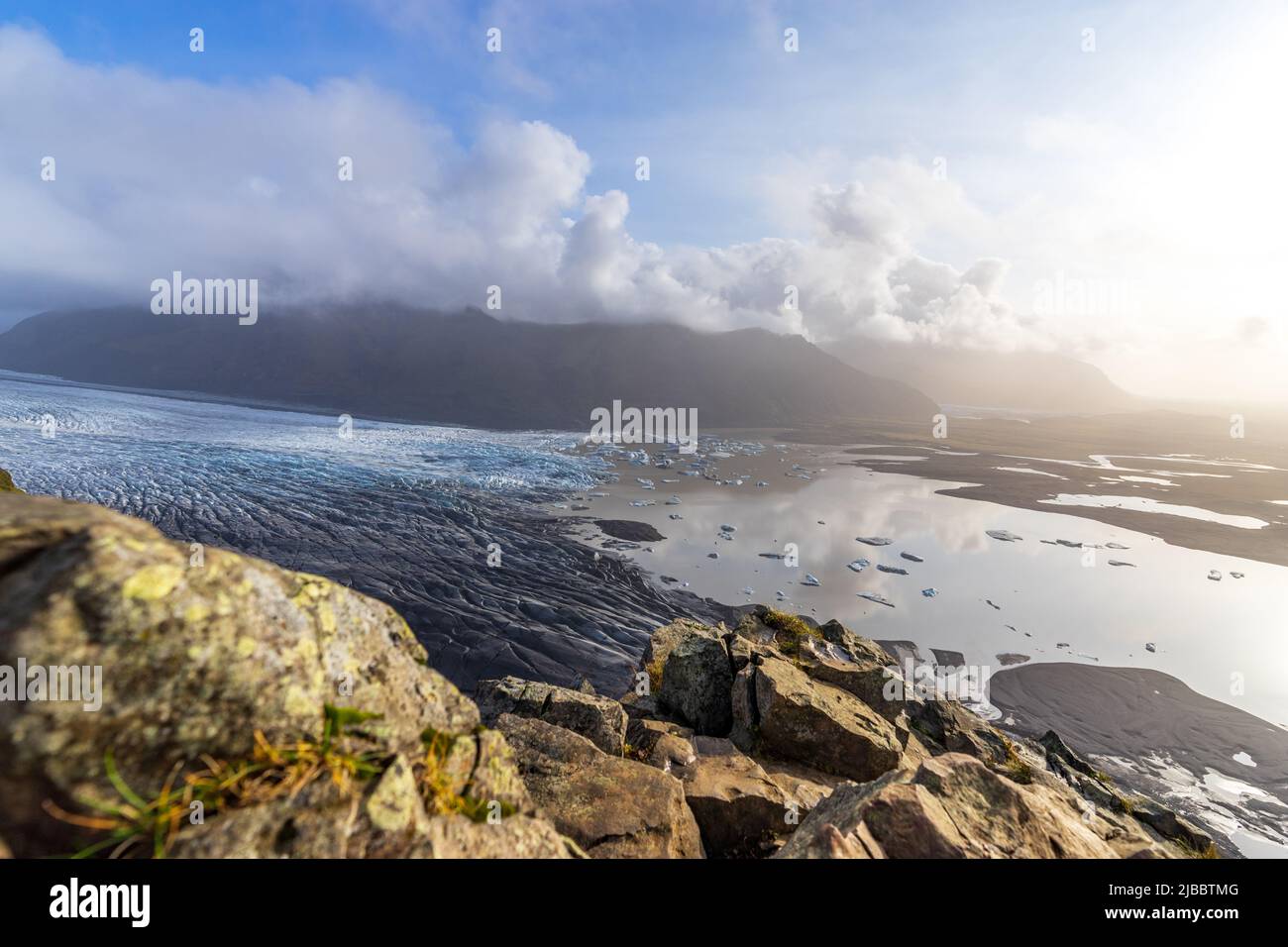 Top view of massive glacier with clouds and ray lights Stock Photo - Alamy