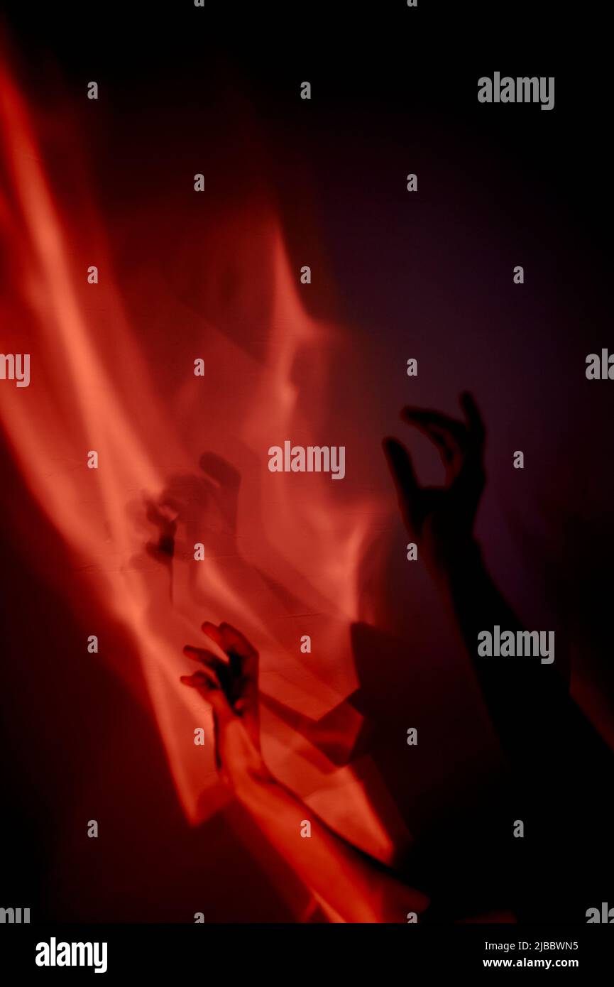 Hands in red light. Abstraction. Shadow theatre, hallucinations Stock ...