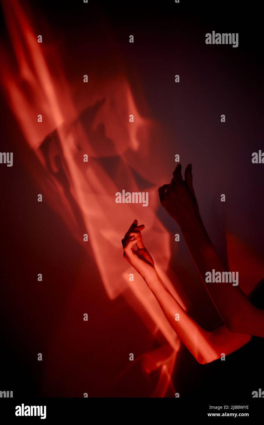Hands in red light. Abstraction. Shadow theatre, hallucinations Stock ...