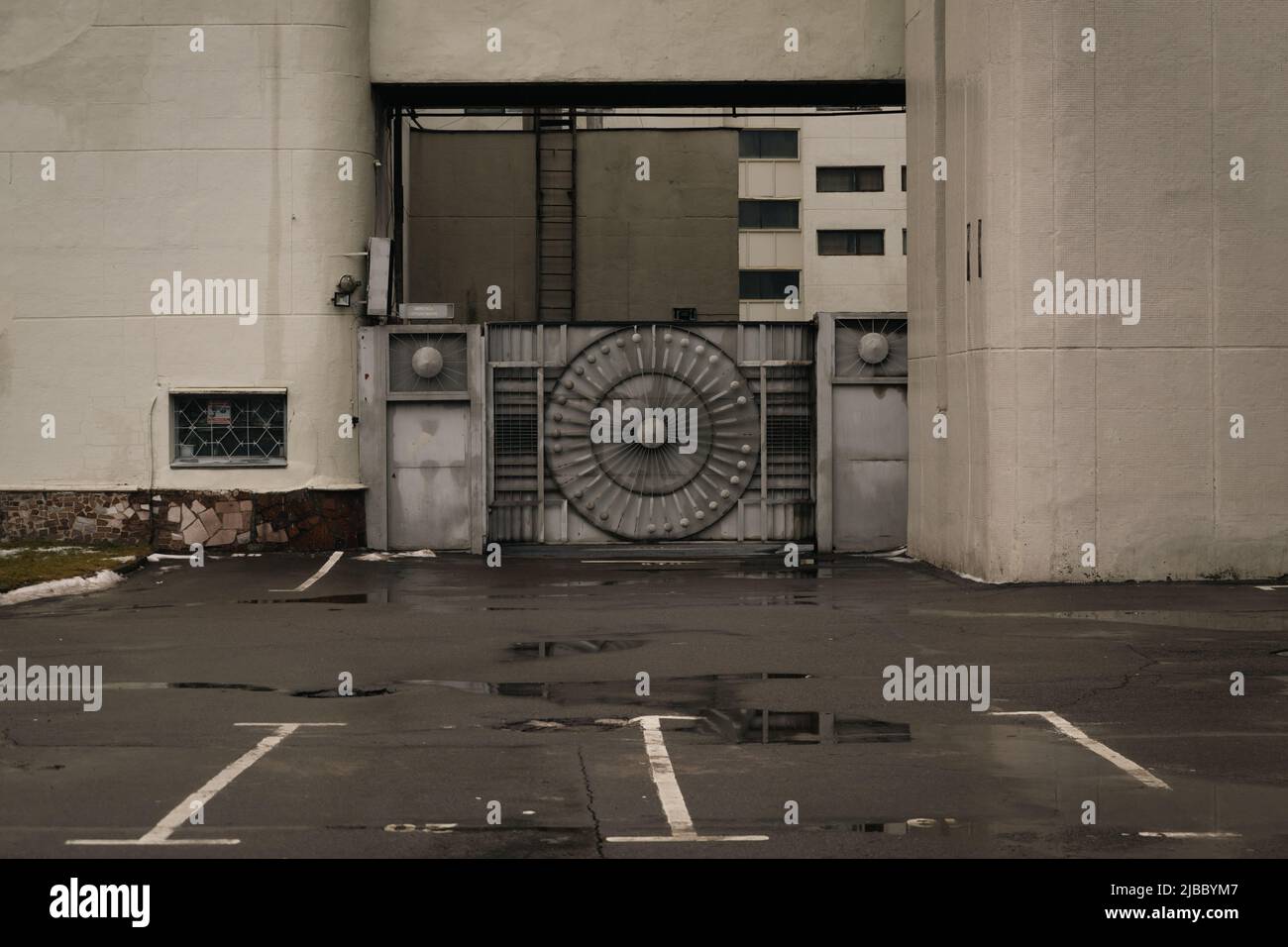 factory steel gray research institute door in a concrete opening utumn ...