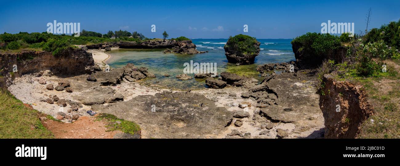 Rocks and hidden sand beaches by the waters of the Indian Ocean at Coco ...