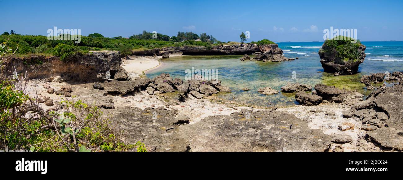 Rocks and hidden sand beaches by the waters of the Indian Ocean at Coco ...