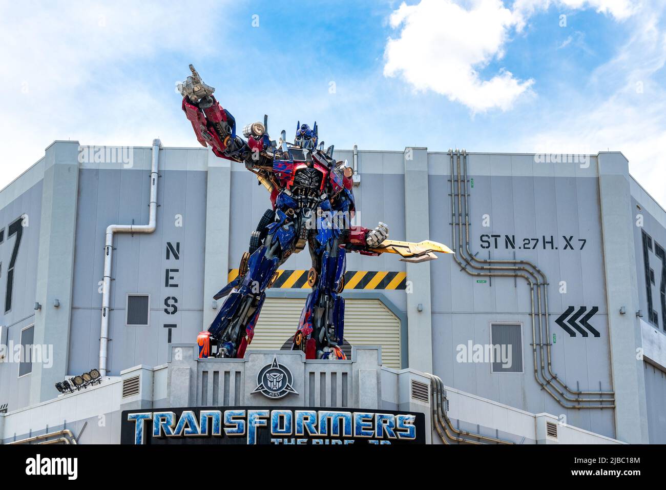 A Transformers statue or sculpture on top of a building. Universal ...