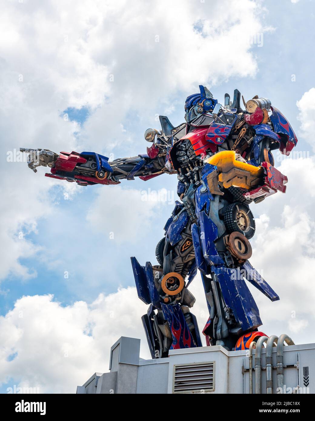 A Transformers statue or sculpture on top of a building. Universal ...
