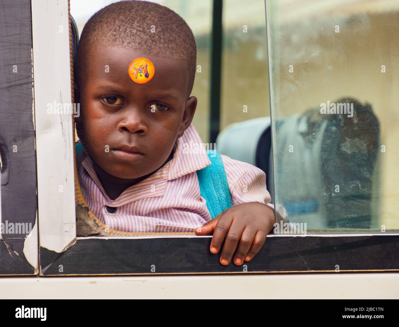 Zanzibar, Tanzania- Jan, 2021: African boy in the bus coming back from ...