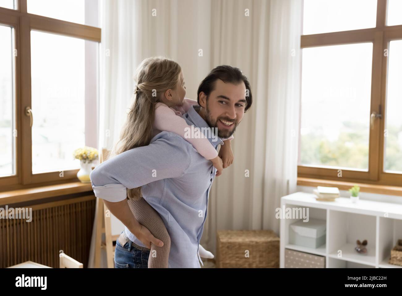 Young active dad play with daughter in modern playroom Stock Photo - Alamy