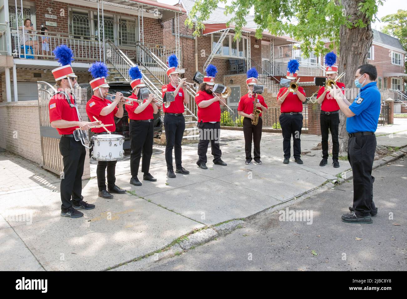 A band marching in the College Point Memorial Day Parade pses for photo ...