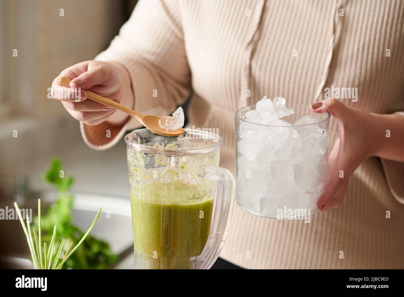 Woman adding ice cubes hi-res stock photography and images - Alamy