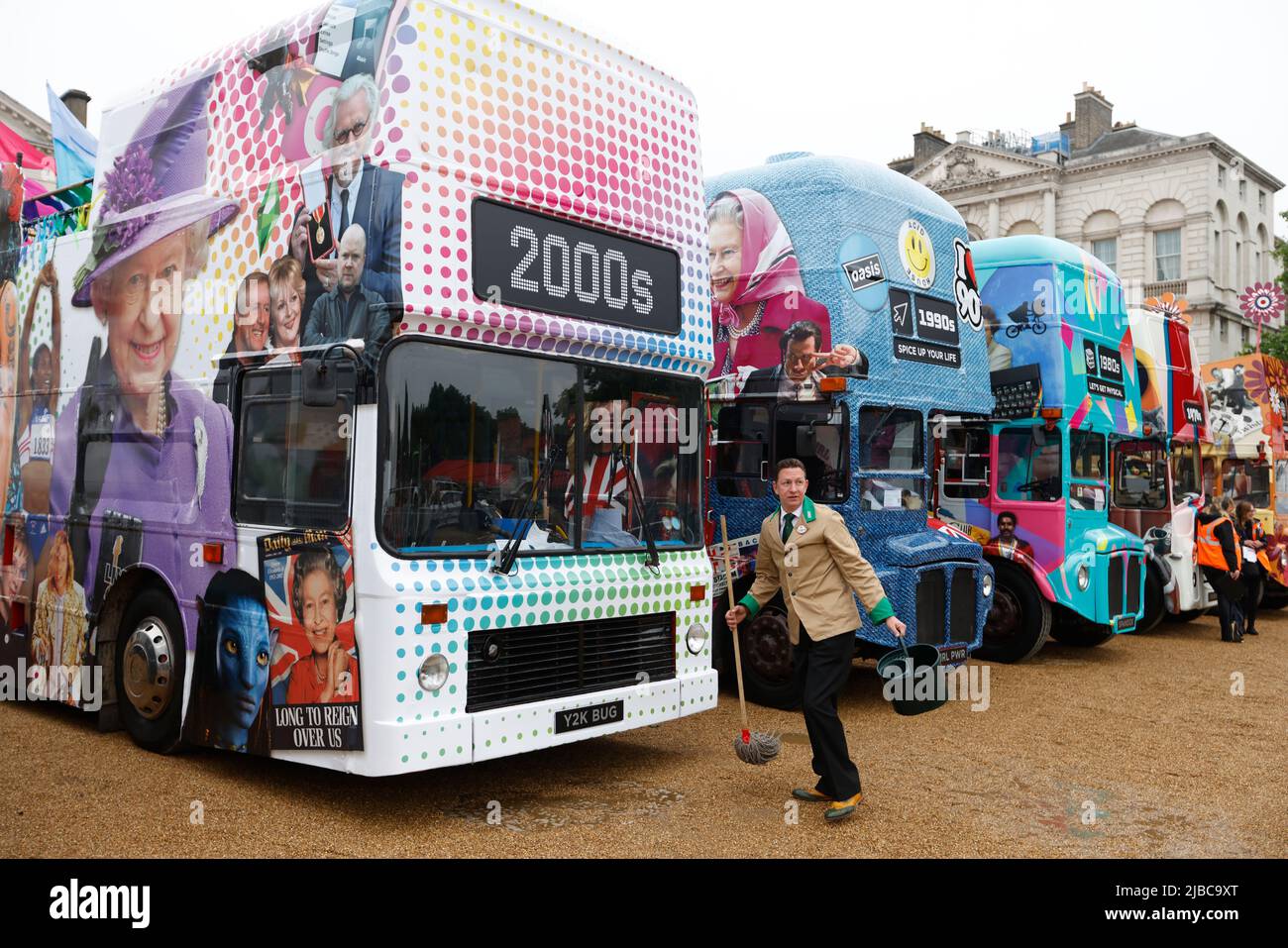 EDITORIAL USE ONLY Buses for the decades at Horse Guards Parade ahead ...