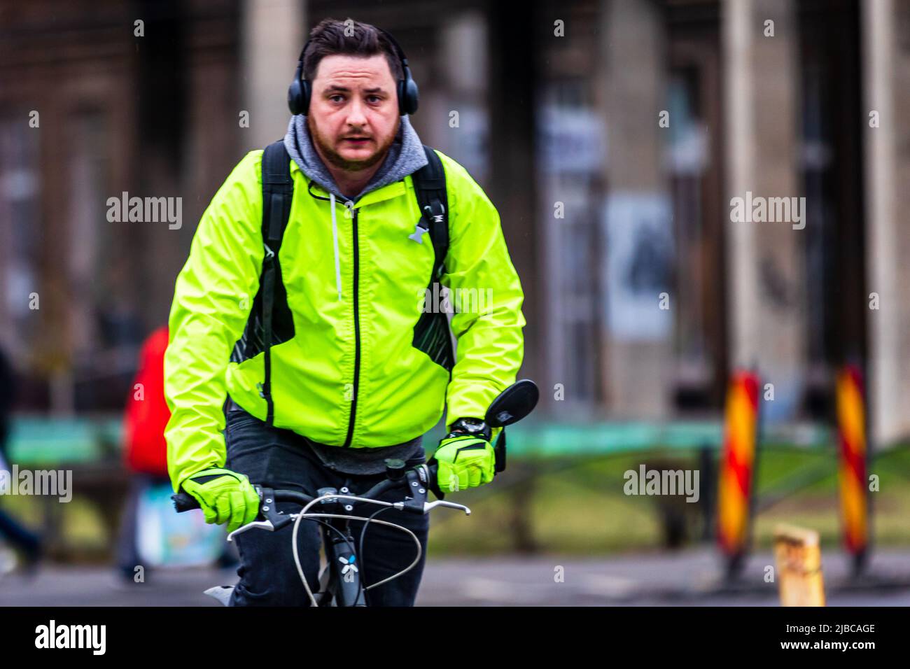 Riding a bicycle on the city streets. Commute to work in Bucharest ...