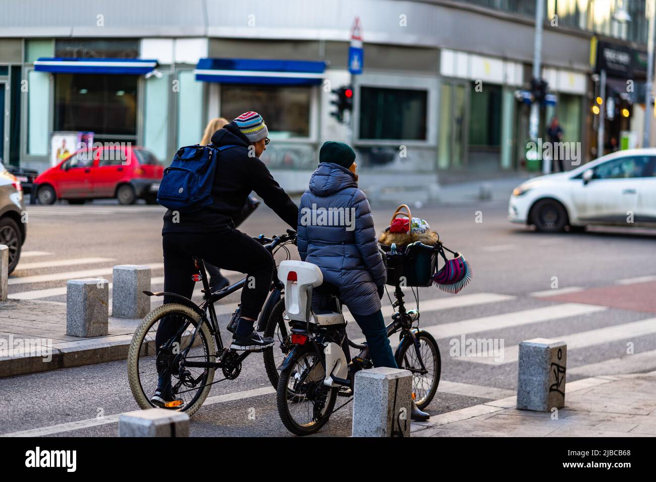 Riding a bicycle on the city streets. Commute to work in Bucharest ...