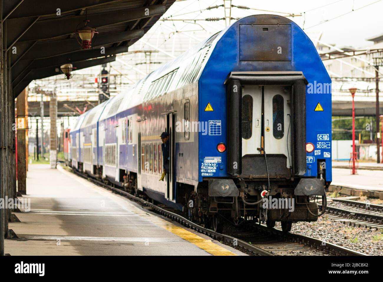 Train in motion or at train platform at Bucharest North Railway Station ...