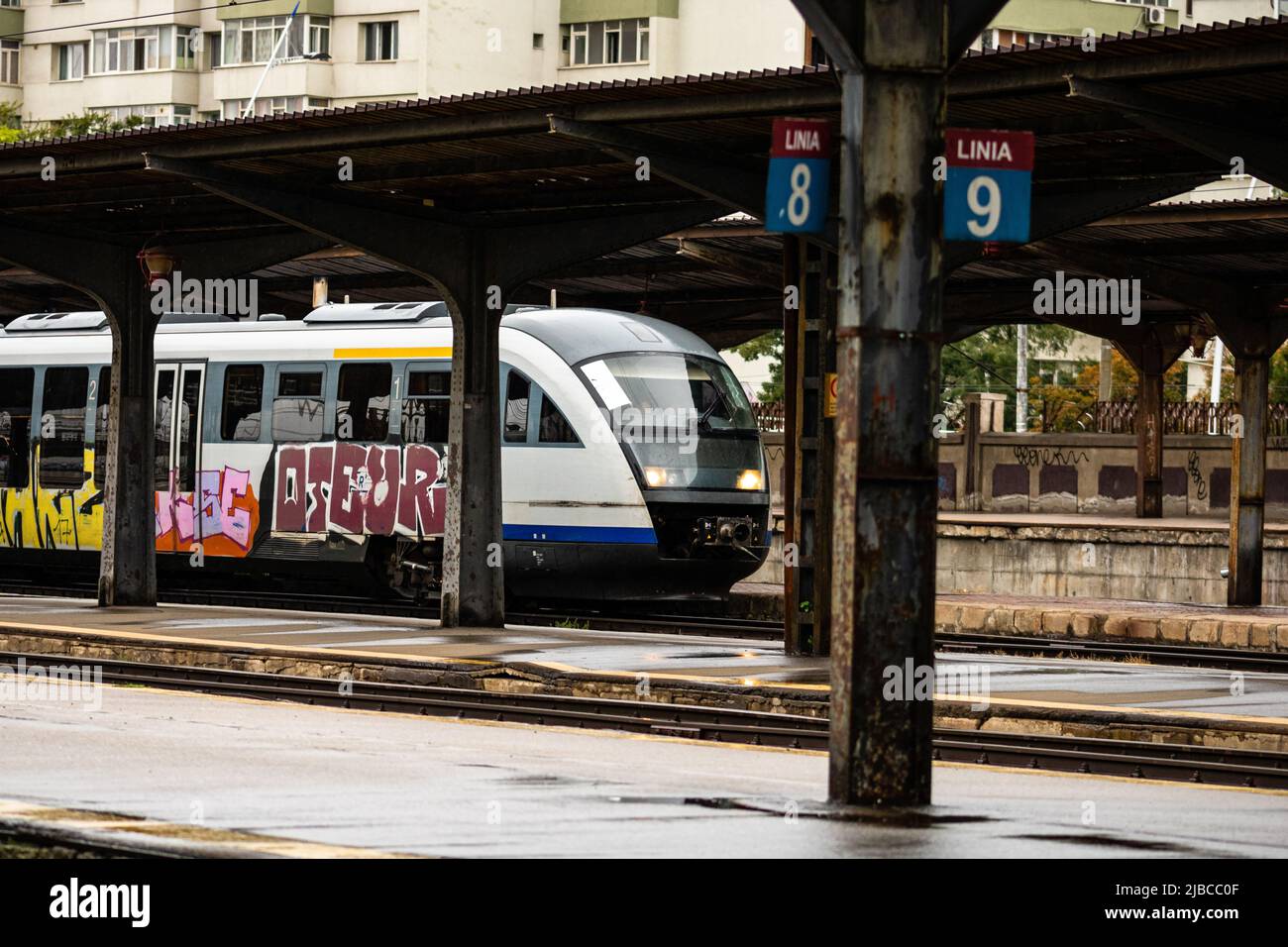 Train in motion or at train platform at Bucharest North Railway Station ...
