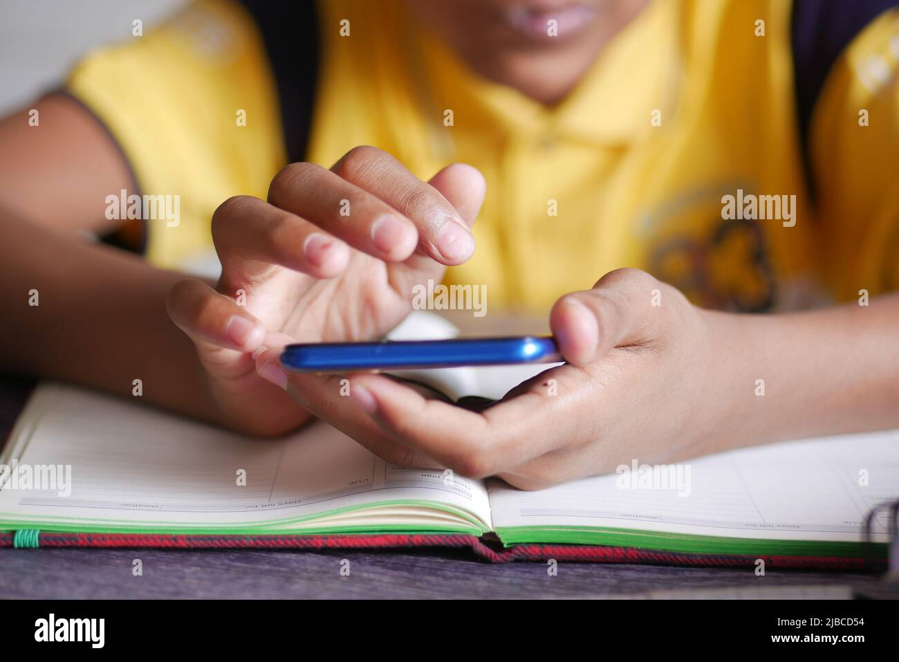 child hand pointing finger on smart phone screen Stock Photo - Alamy