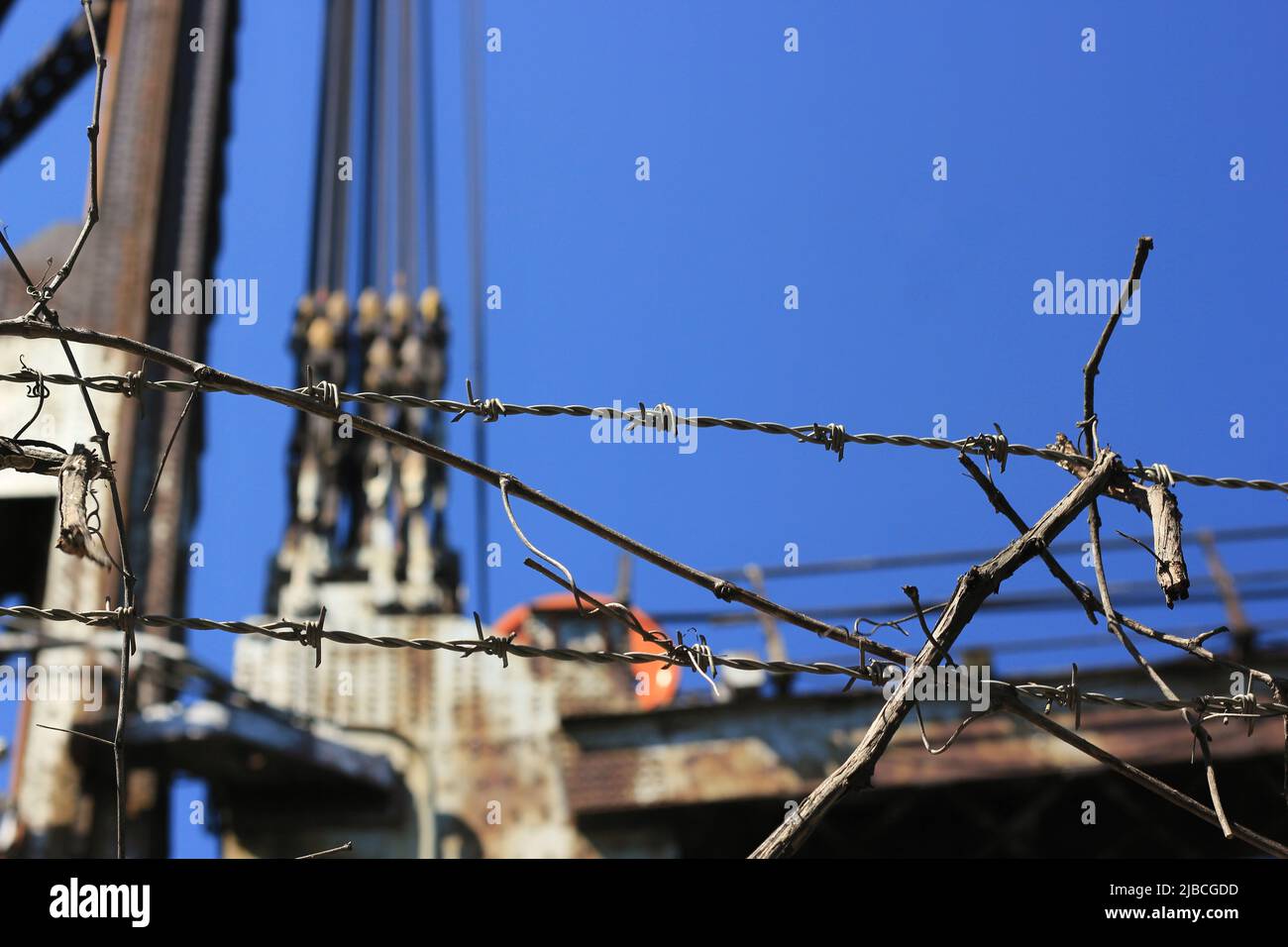 Razor sharp barbed wire fence protecting the industrial area Stock ...