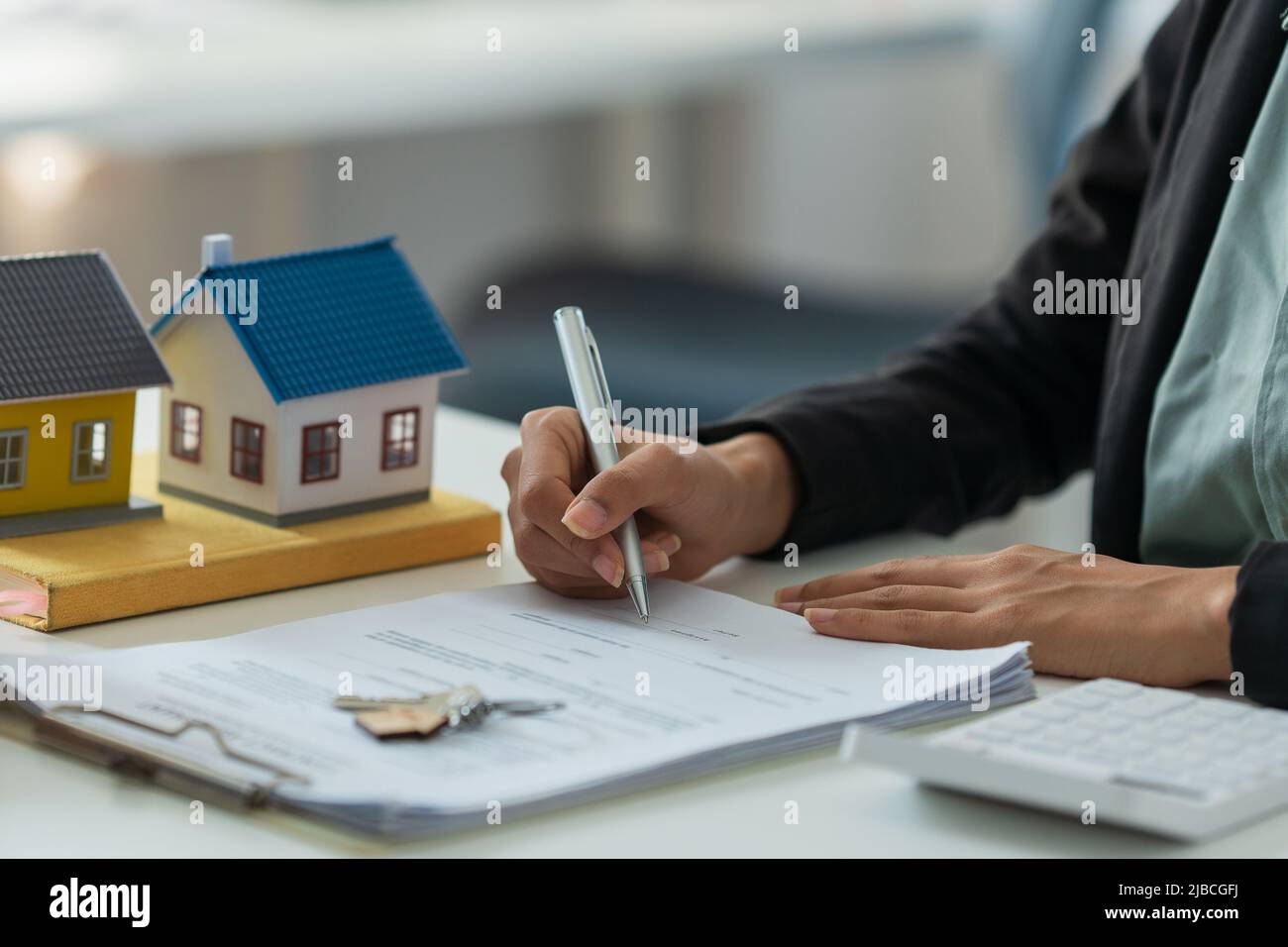 Close up Business woman sign in agreement contract. Real estate concept ...