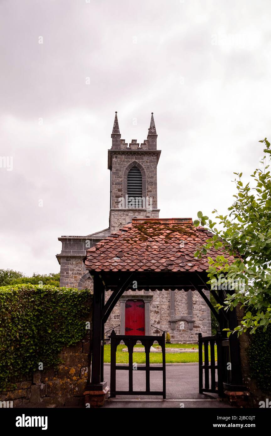 Crenellated tower and roofed lichgate of St. Patrick's Church in Ardagh ...