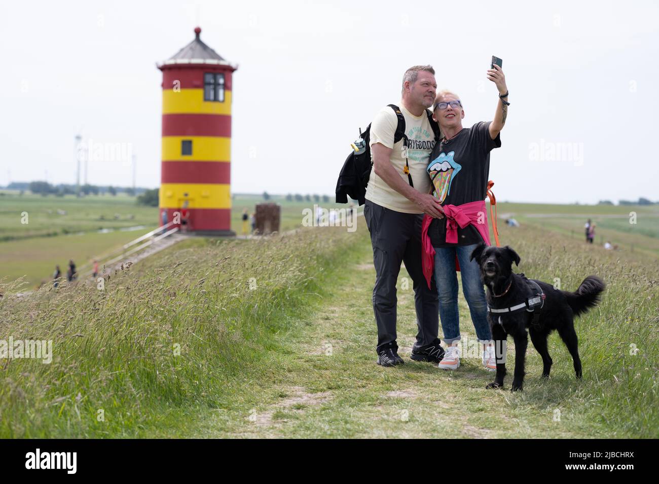 Pilsum, Germany. 05th June, 2022. A couple takes a selfie at the ...