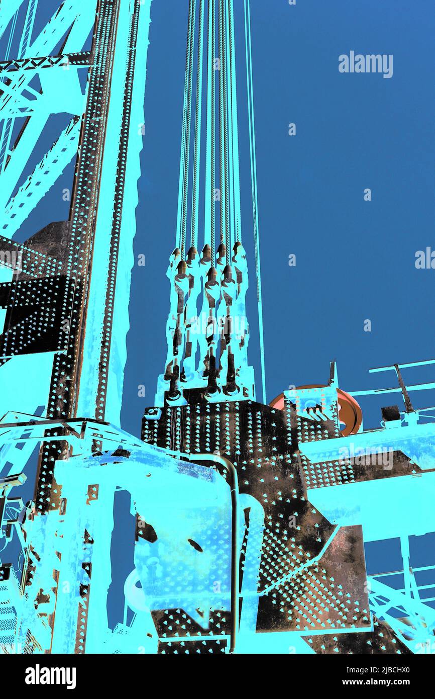 A very tall steel truss structure standing in the industrial district ...