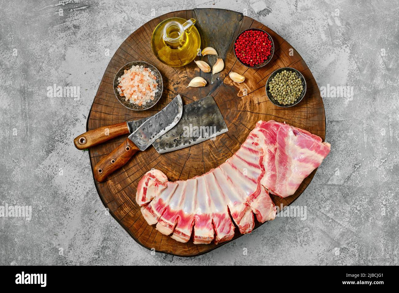 Raw fresh lamb flap ribs with ingredients on wooden log, top view Stock ...