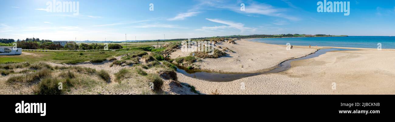 Panorama of Sola beach, sand dunes and a small river entering the sea ...
