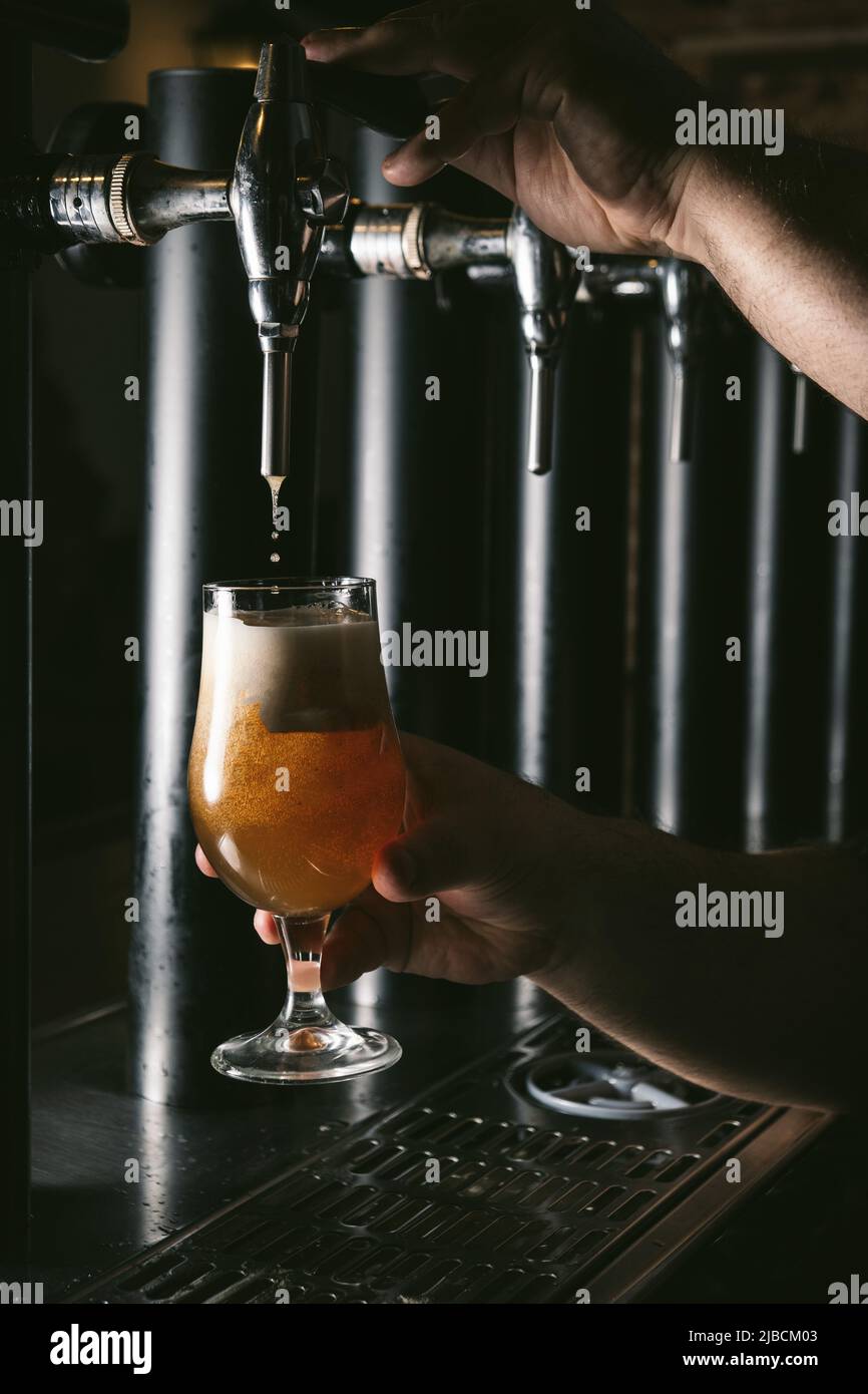 Barman pouring lager beer in hi-res stock photography and images - Alamy