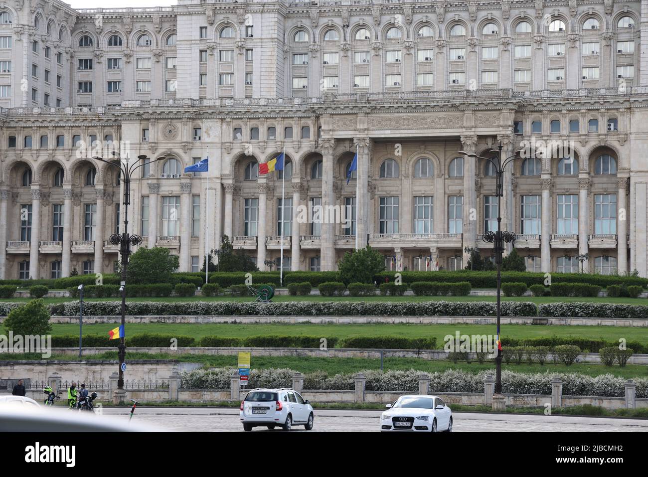NATO, Romanian & EU flags in front of the House of the people in ...
