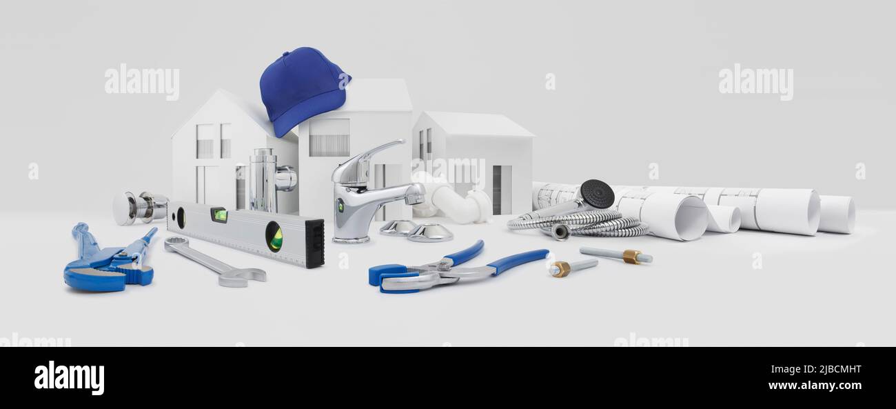 plumbing service, components and plumber work tools on desk with model ...