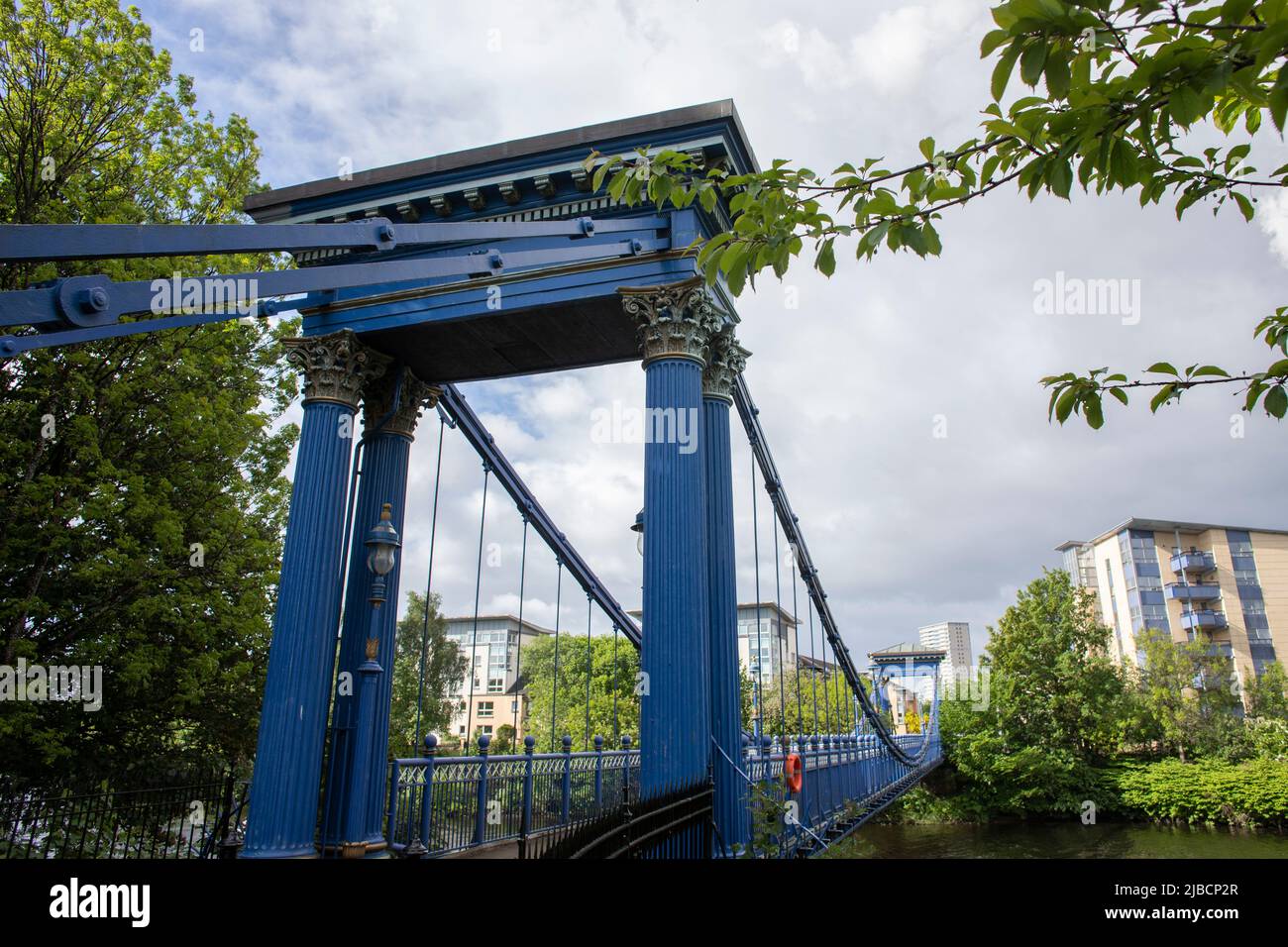 The blue-painted St Andrew's Suspension Bridge, over the River Clyde in ...