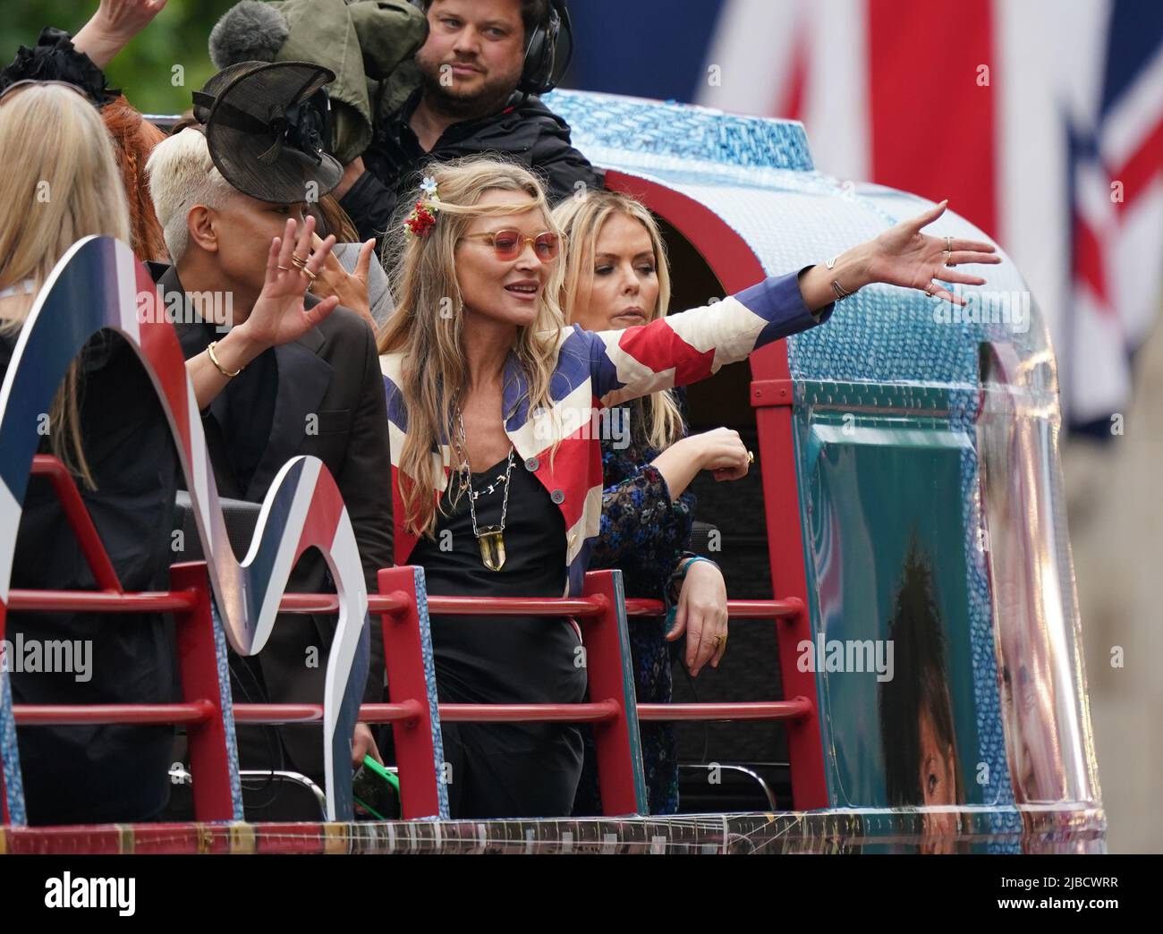 Kate Moss (centre) and Patsy Kensit (right)waves to the crowd during ...